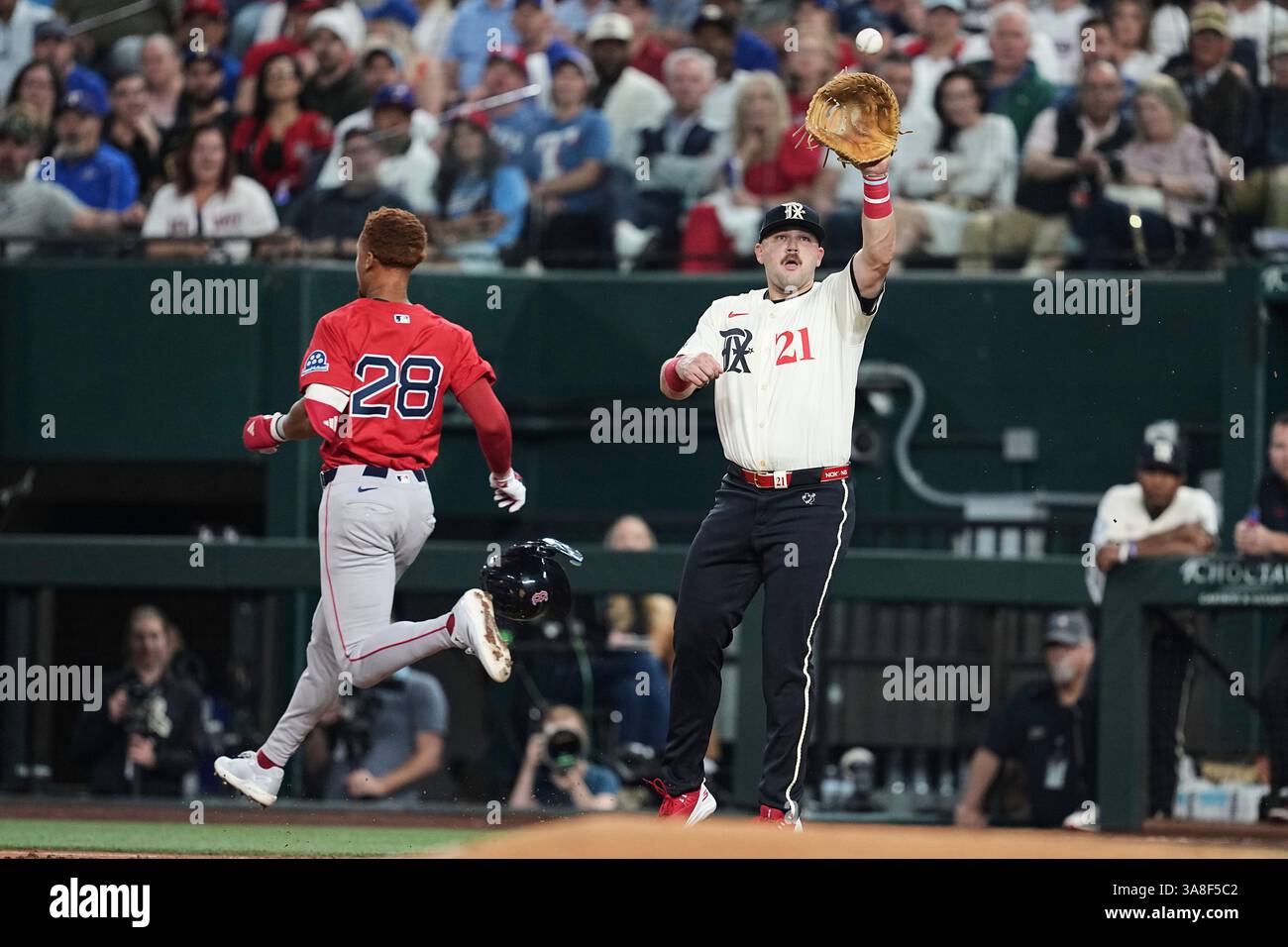 Texas Rangers first baseman Jake Burger (21) reaches up for the throw ...