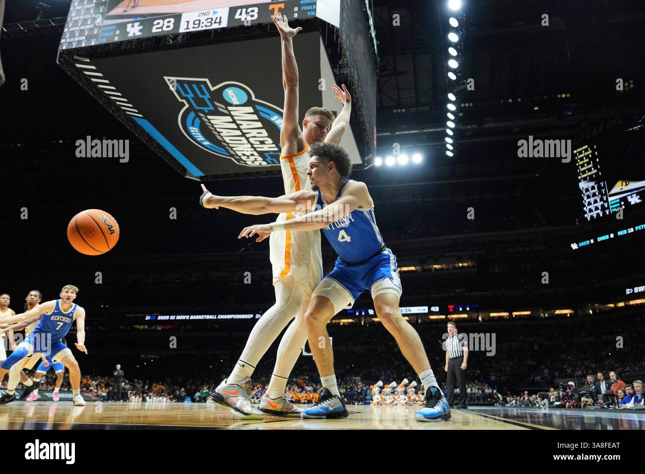 Kentucky's Koby Brea (4) passes around Tennessee's Igor Milicic Jr ...