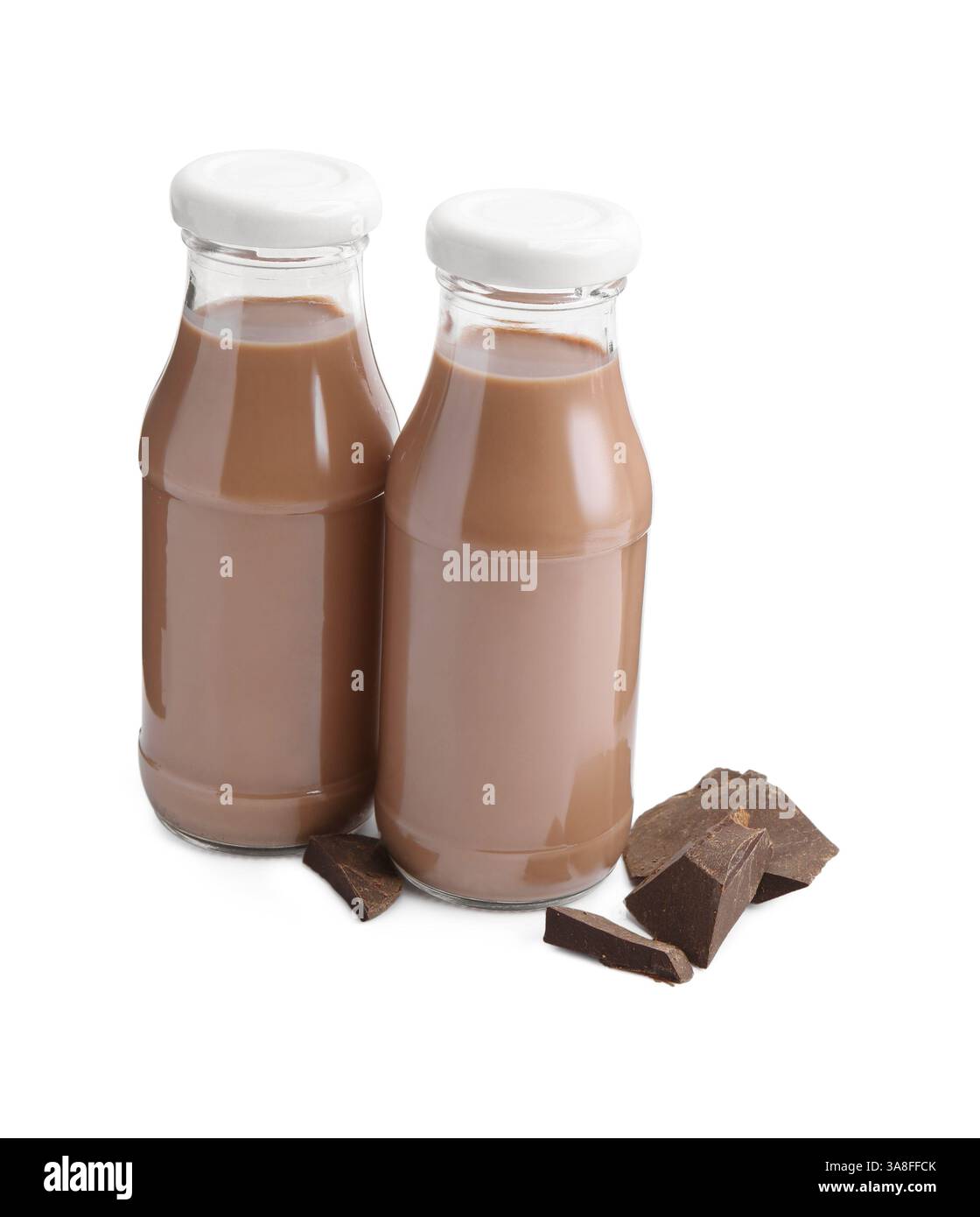 Tasty chocolate milk in glass bottles and pieces of chocolate isolated ...