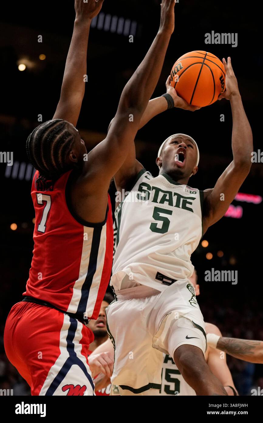 Michigan State guard Tre Holloman (5) shoots against Mississippi guard ...