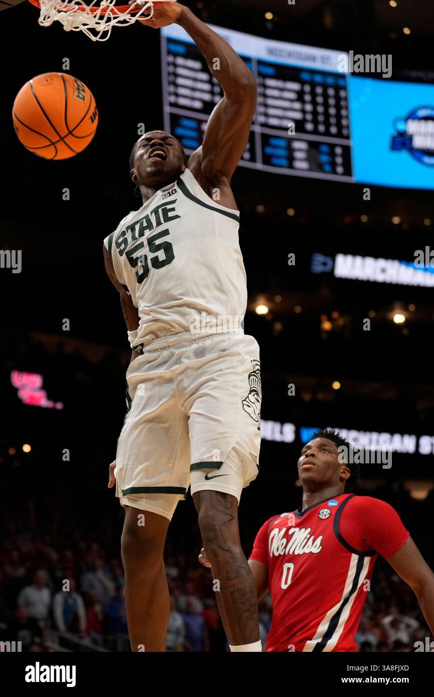 Michigan State forward Coen Carr (55) dunks against Mississippi forward ...