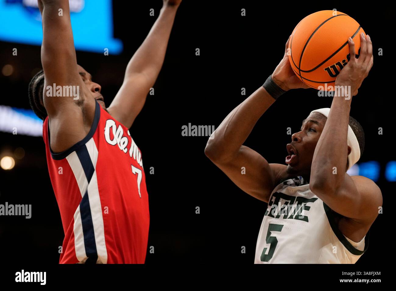 Michigan State guard Tre Holloman (5) shoots against Mississippi guard ...