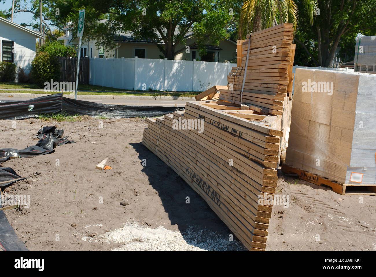 Stacks of lumber at a construction site. Arranged in an organized ...