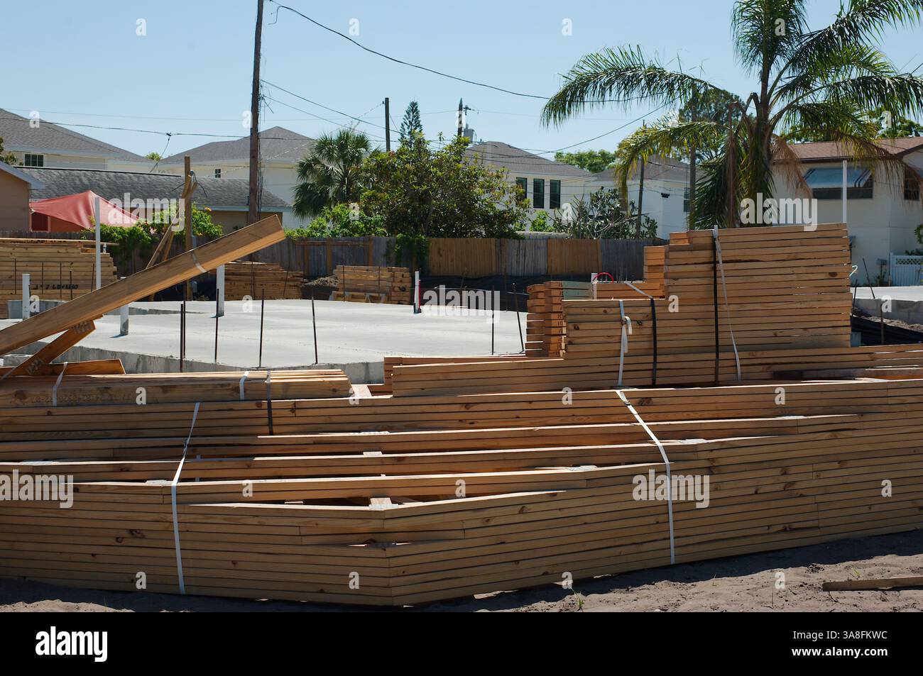 Stacks of lumber at a construction site. Arranged in an organized ...