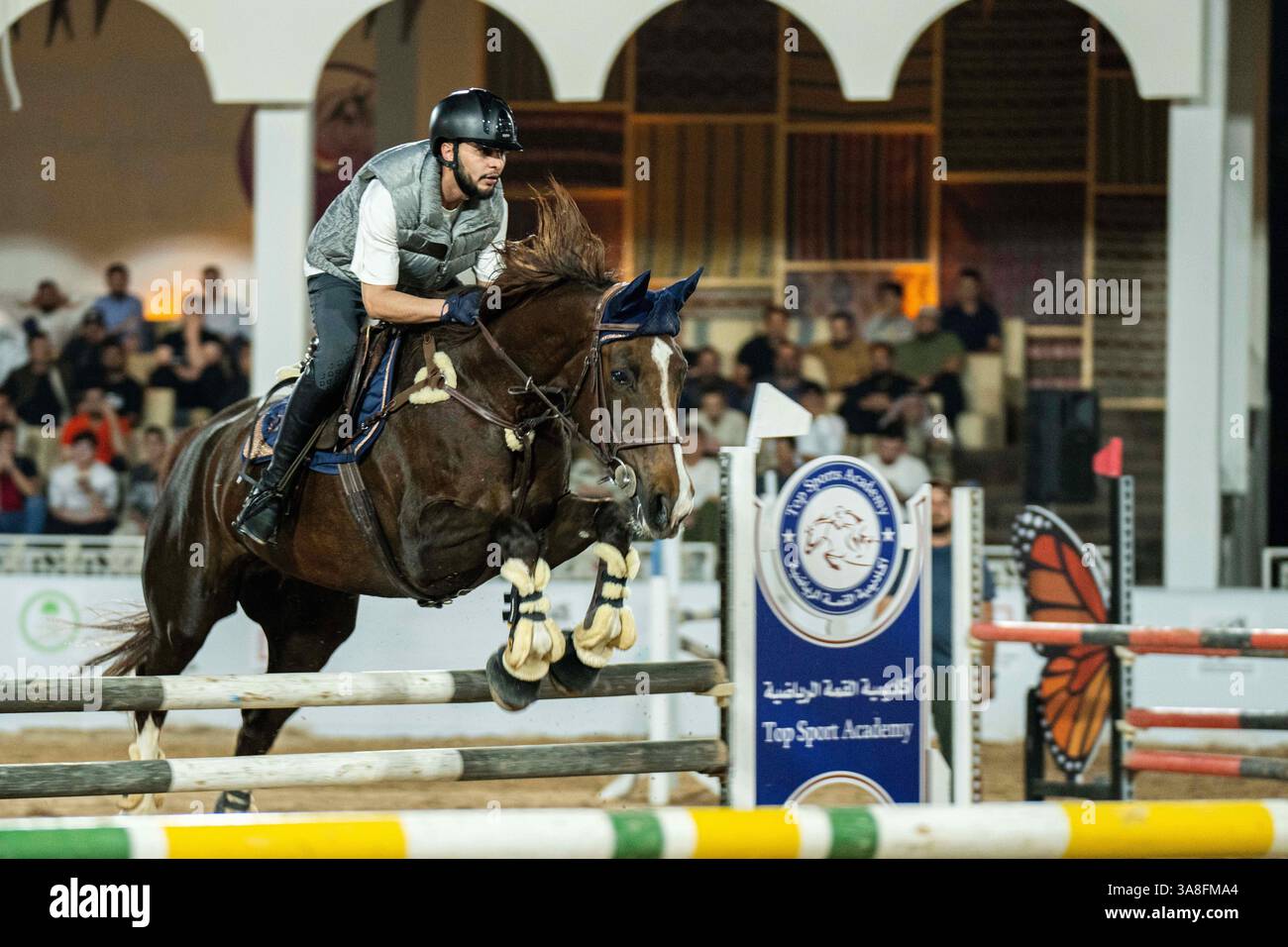 Mohammad Moften on his horse competes in the Show Jumping Championship ...
