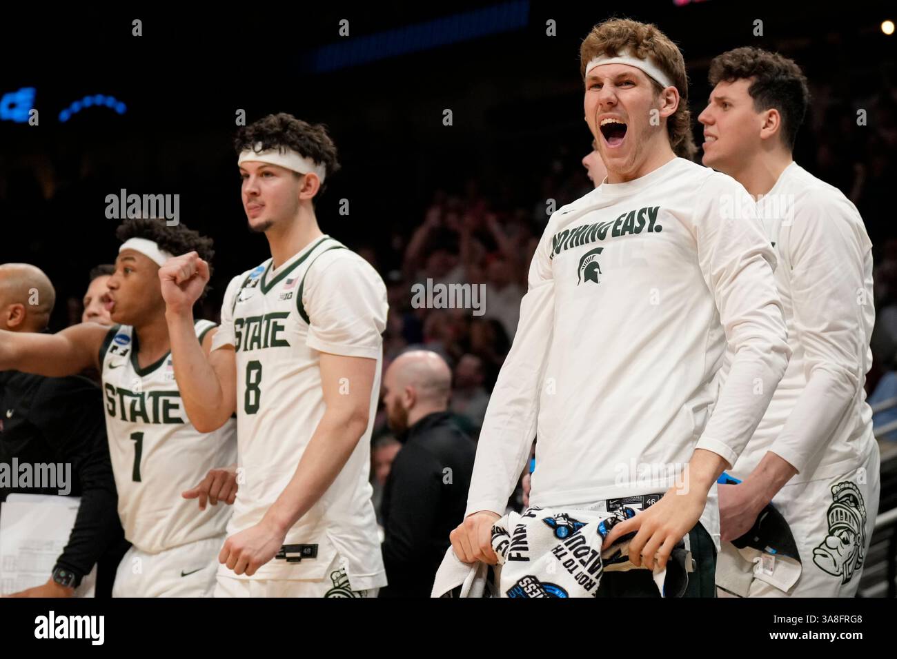 The Michigan State bench cheers play against Mississippi during the ...