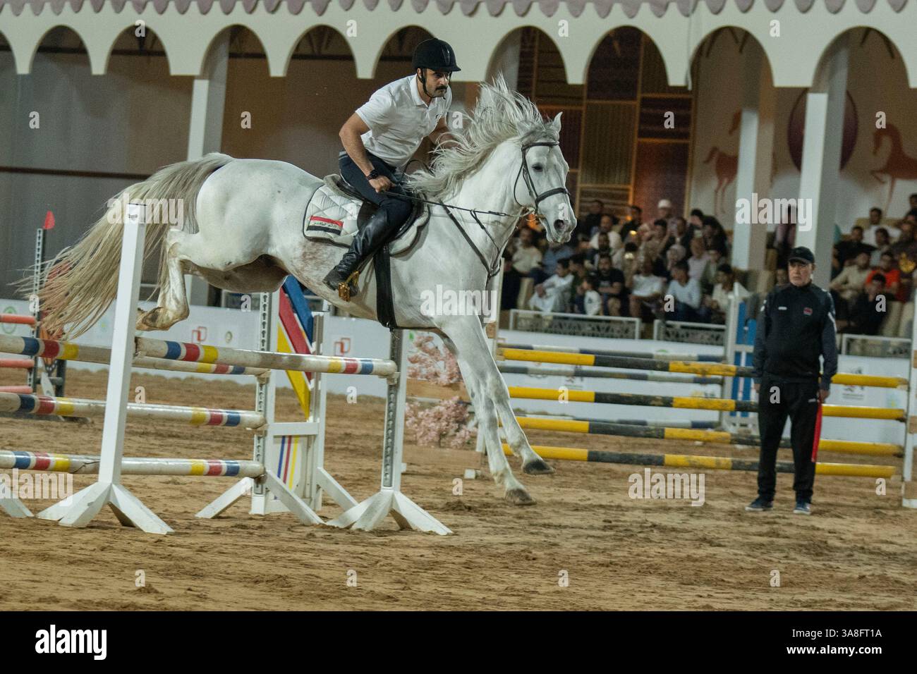 Humam Haithem on his horse competes in the Show Jumping Championship at ...