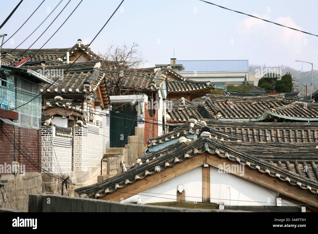 Rooftop view of Bukchon Hanok Village in Seoul, with tiled roofs and ...
