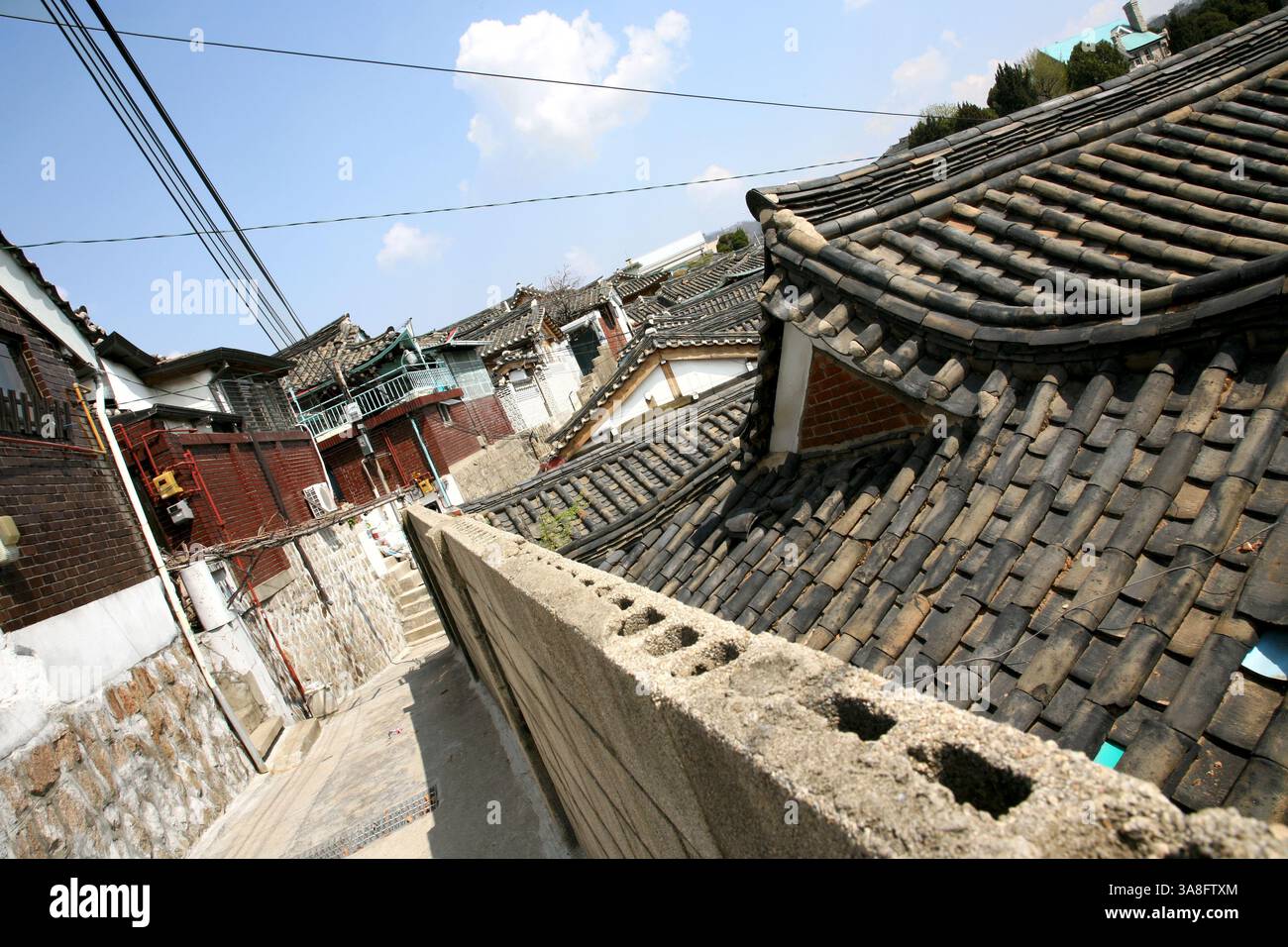 Rooftop view of Bukchon Hanok Village in Seoul, with tiled roofs and ...