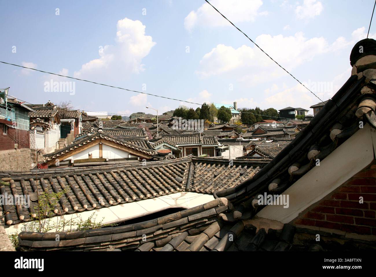 Rooftop view of Bukchon Hanok Village in Seoul, with tiled roofs and ...