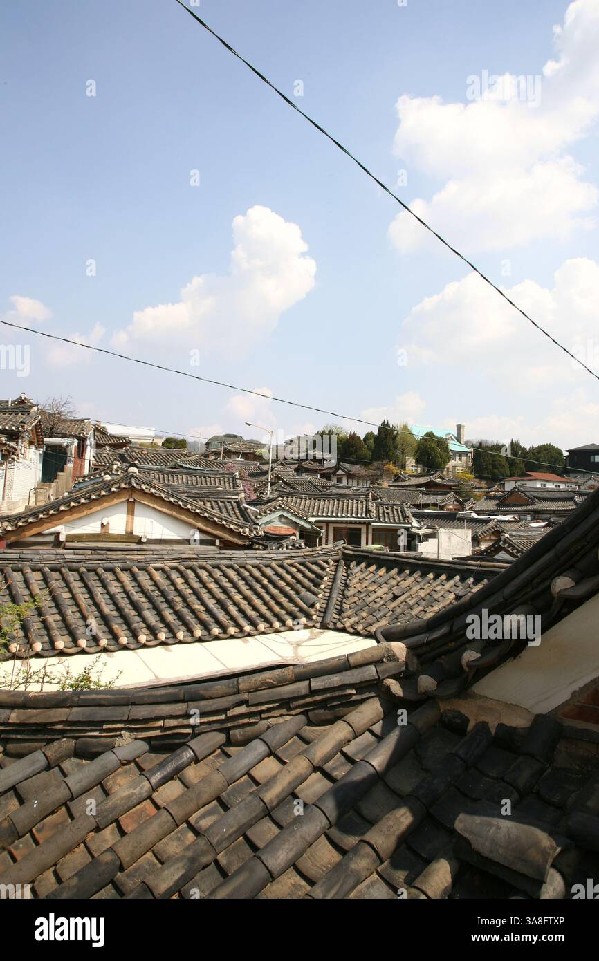 Rooftop view of Bukchon Hanok Village in Seoul, with tiled roofs and ...