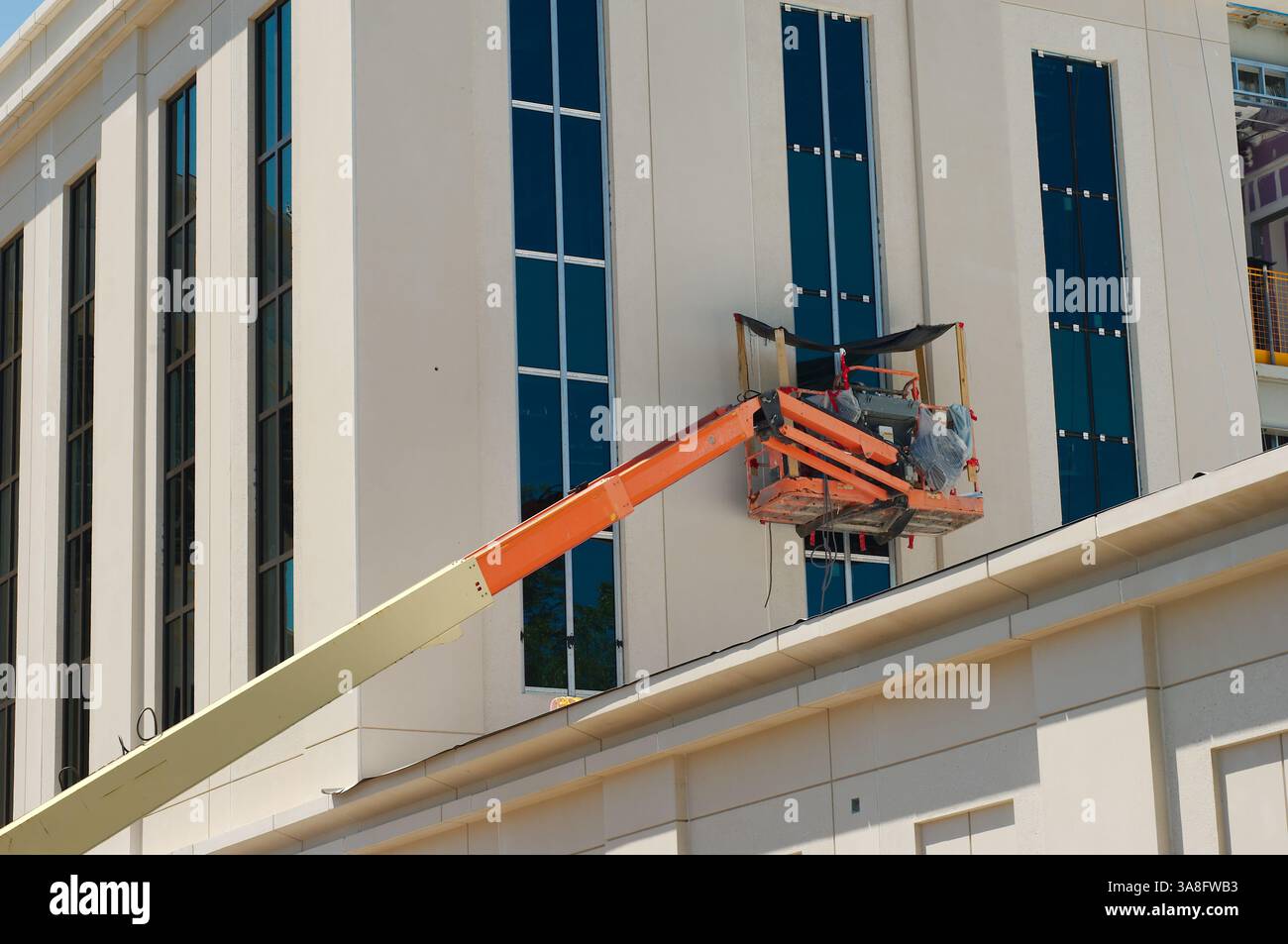 Construction lift, specifically a boom lift articulating being used for ...