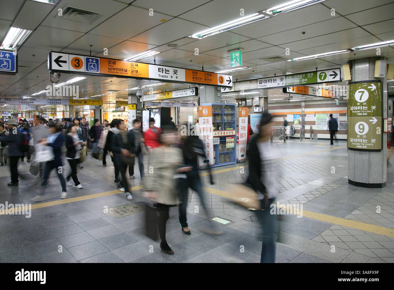 SEOUL, SOUTH KOREA. 23 APRIL, 2011. Commuters move through a busy ...