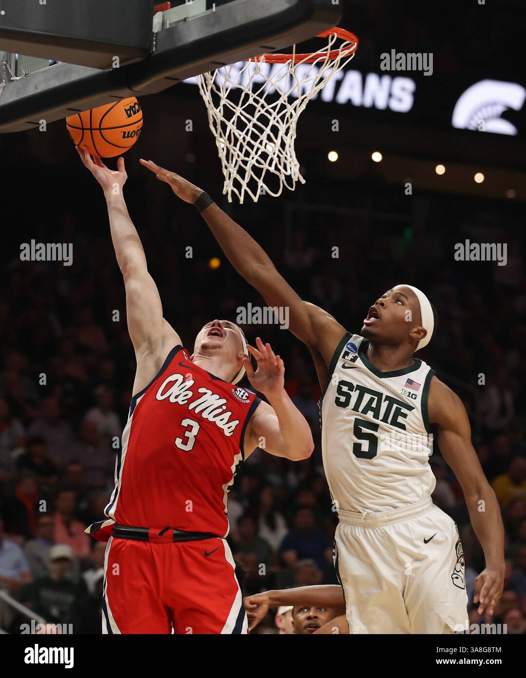 Ole Miss guard Sean Pedulla (3) shoots around Michigan State guard Tre ...