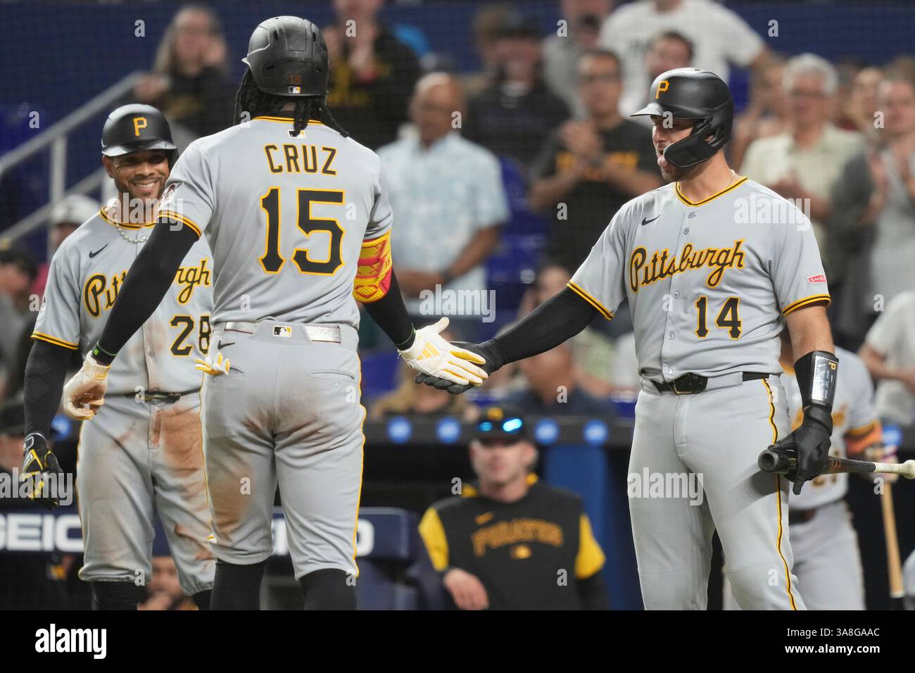 Pittsburgh Pirates' Oneil Cruz (15) is met by Tommy Pham (28) and Joey ...