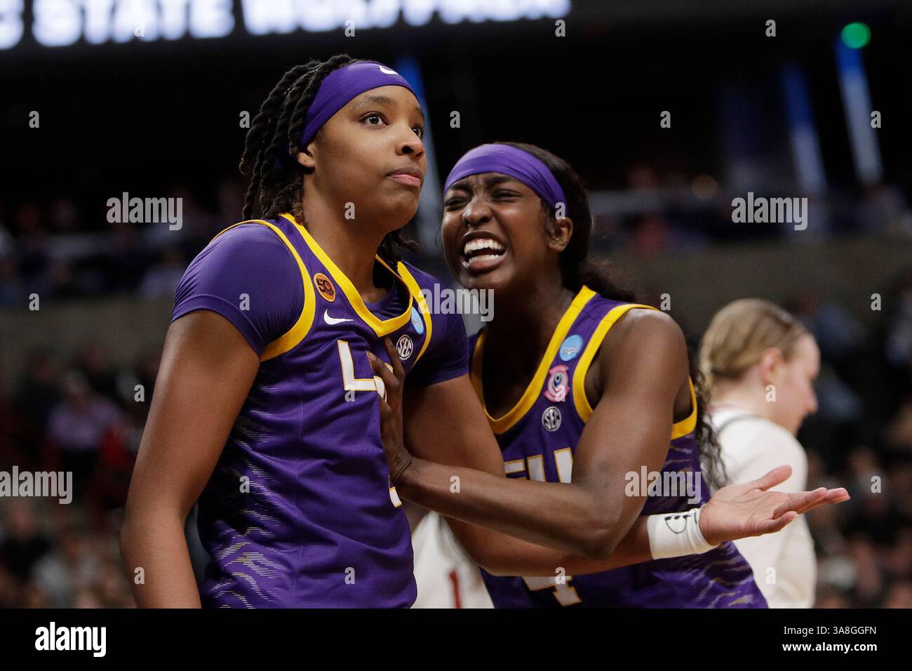 LSU forward Sa'Myah Smith, left, celebrates with guard Flau'Jae Johnson ...