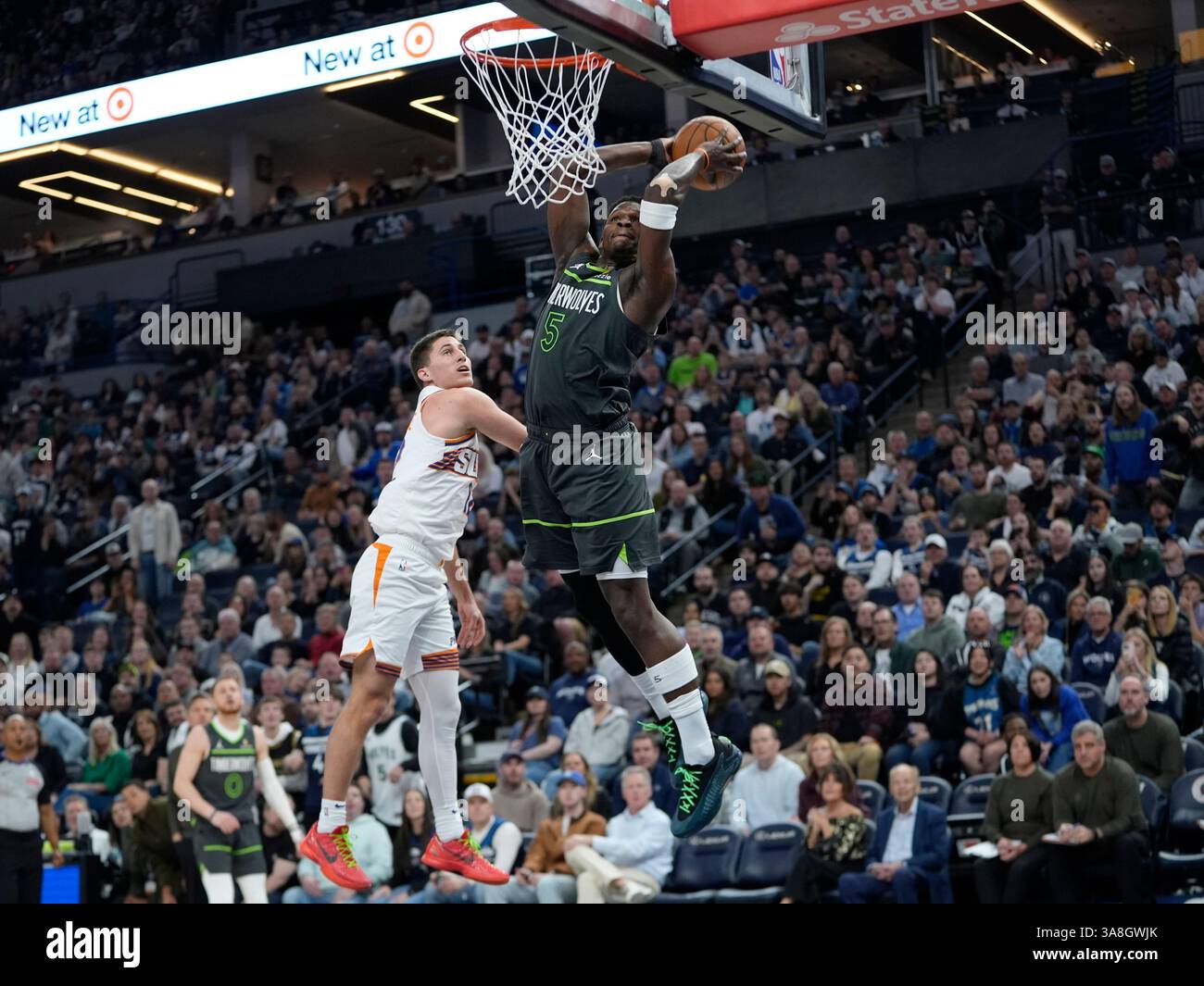 Minnesota Timberwolves guard Anthony Edwards (5) goes up for a dunk as ...