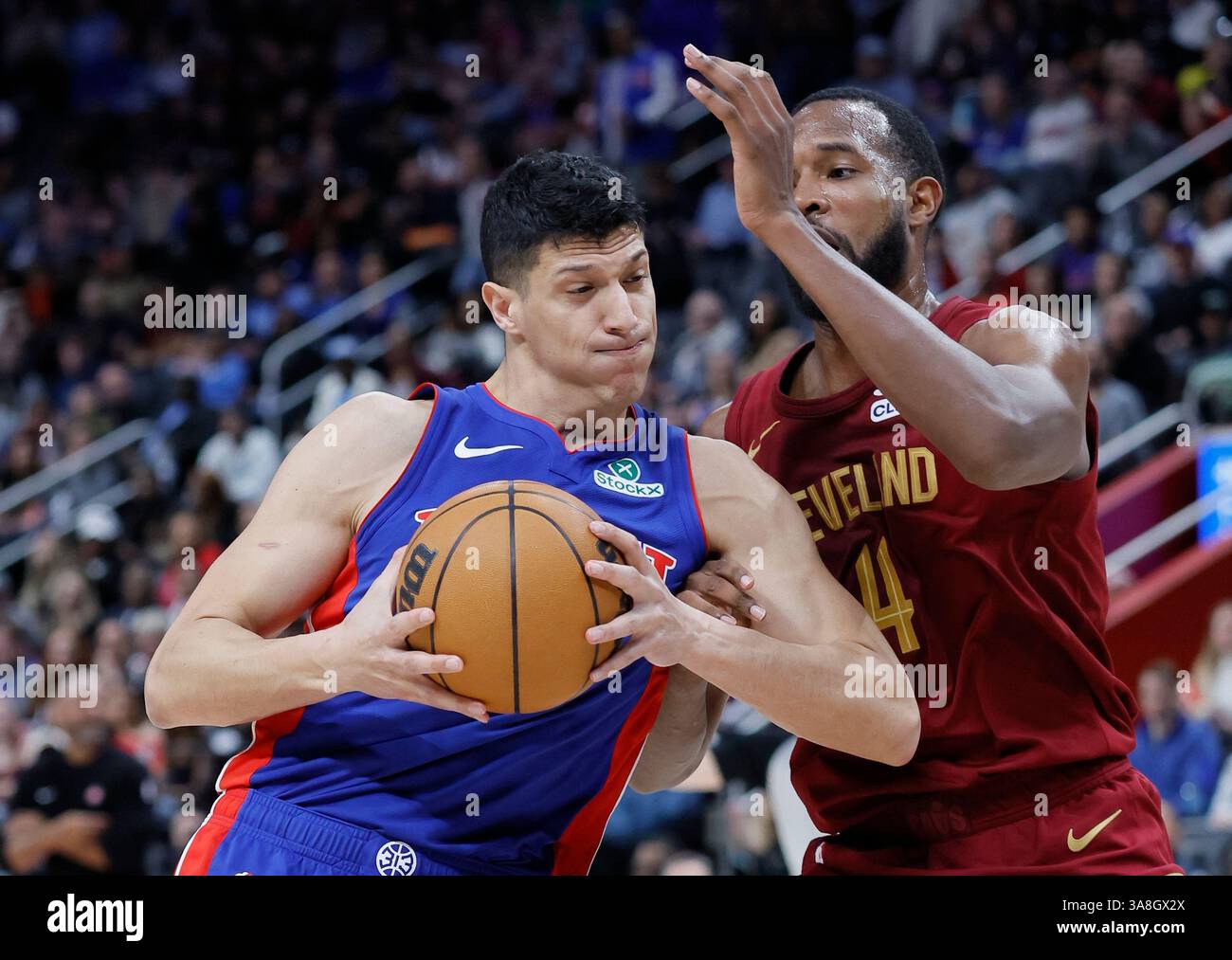 Detroit Pistons forward Simone Fontecchio (19) drives against Cleveland Cavaliers forward Evan ...