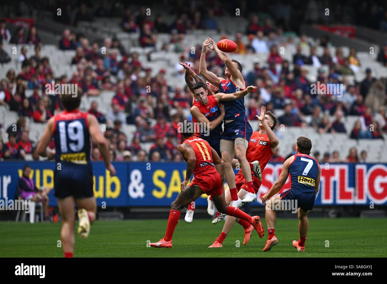 Xavier Lindsay of the Demons (left) contests a mark during the AFL ...