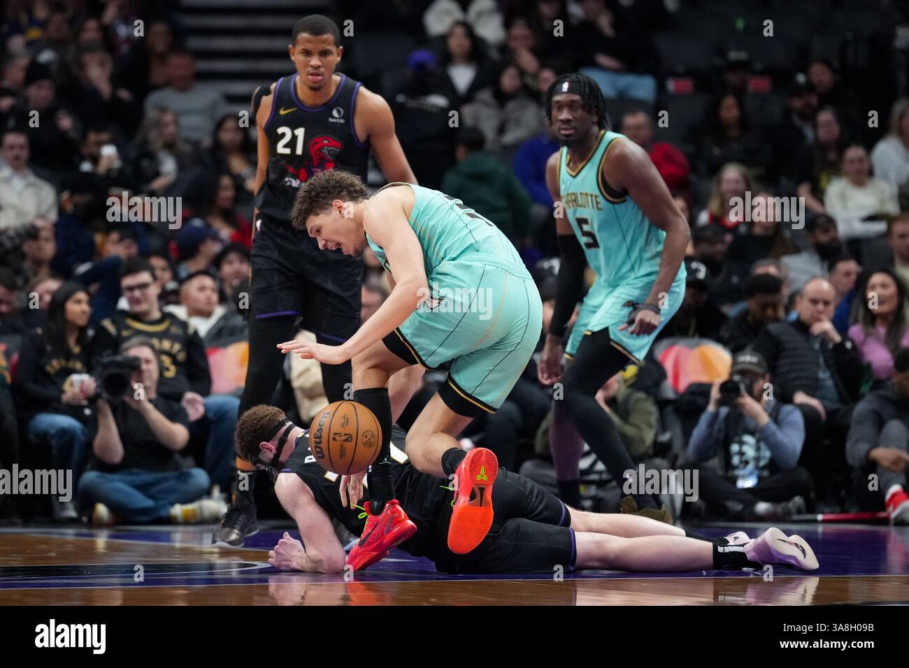 Charlotte Hornets forward Tidjane Salaun (front top) reacts after ...