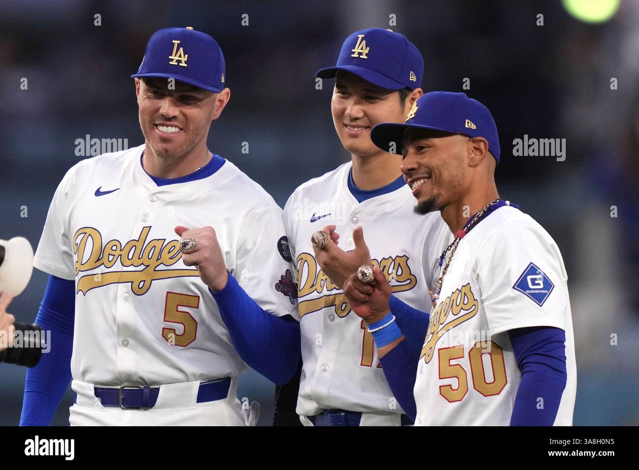 Los Angeles Dodgers' Freddie Freeman, left, Shohei Ohtani, center, and ...