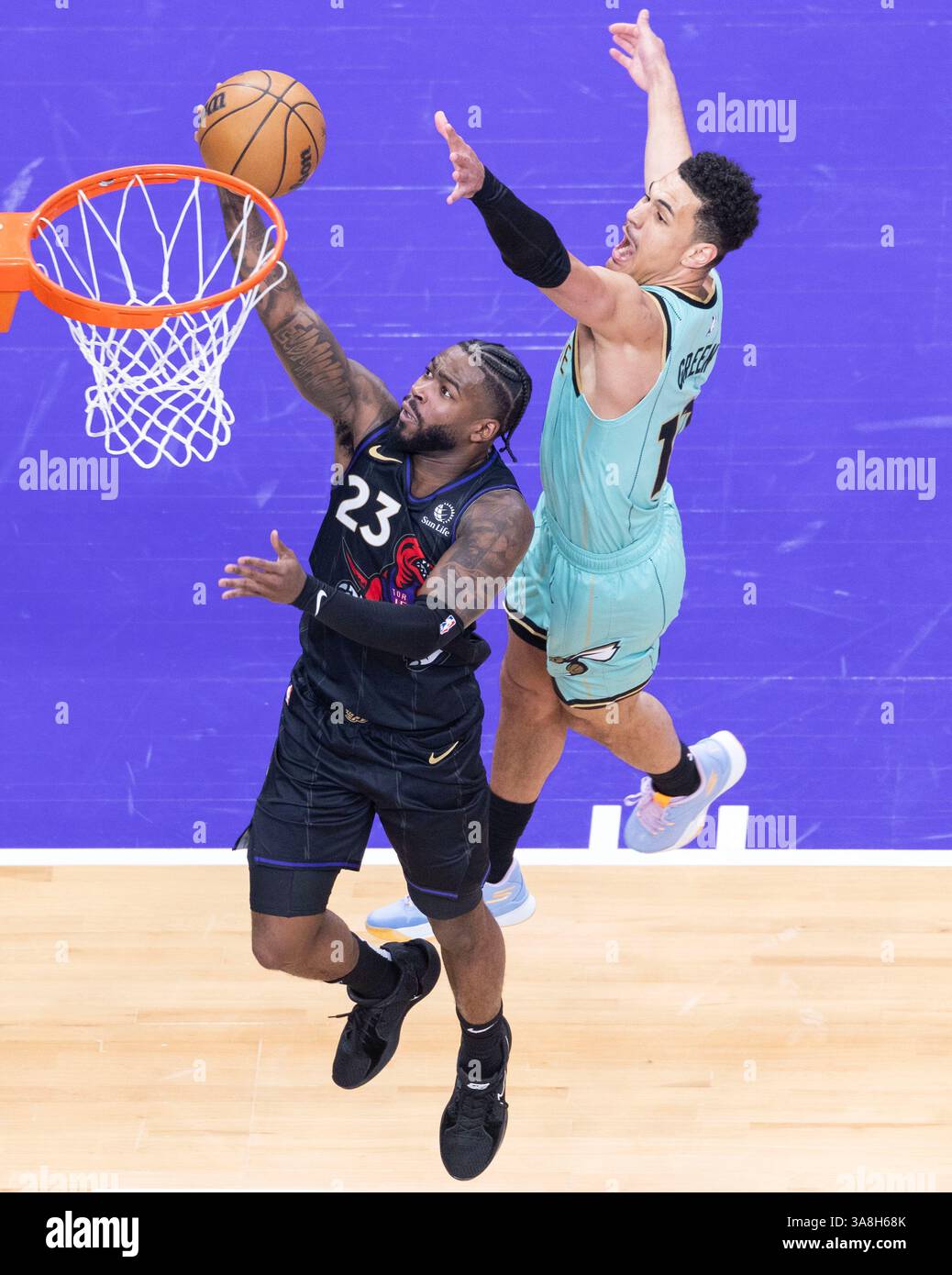 Toronto, Canada. 28th Mar, 2025. Jamal Shead (L) of Toronto Raptors ...