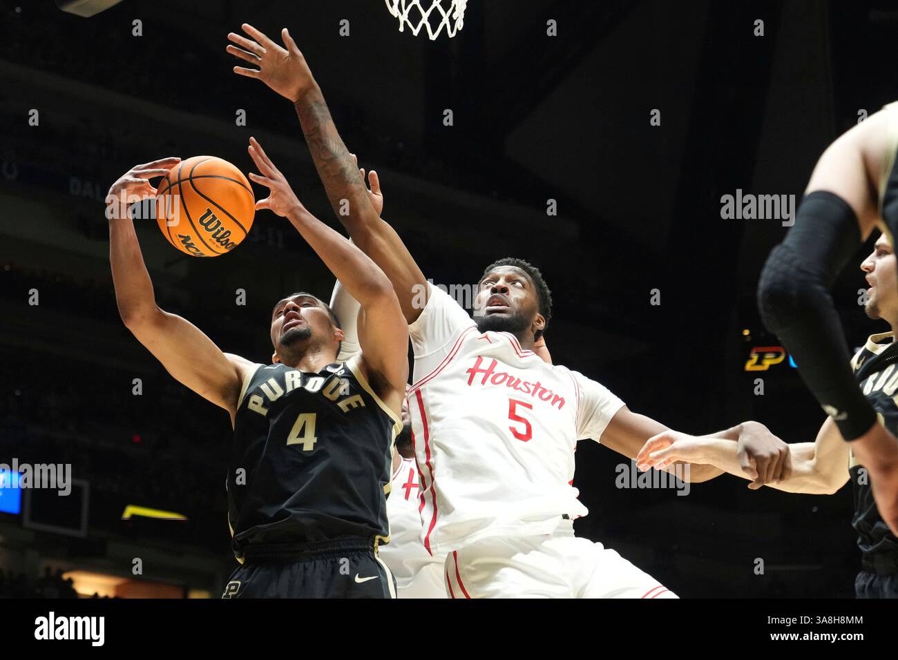 Purdue's Trey Kaufman-Renn (4) and Houston's Ja'Vier Francis (5) reach ...