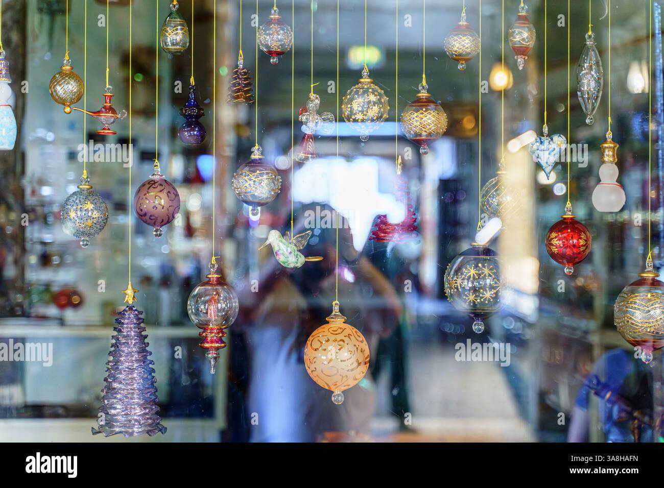 Doha, Qatar - Jan 14 2024, A close-up view of a glass storefront behind ...