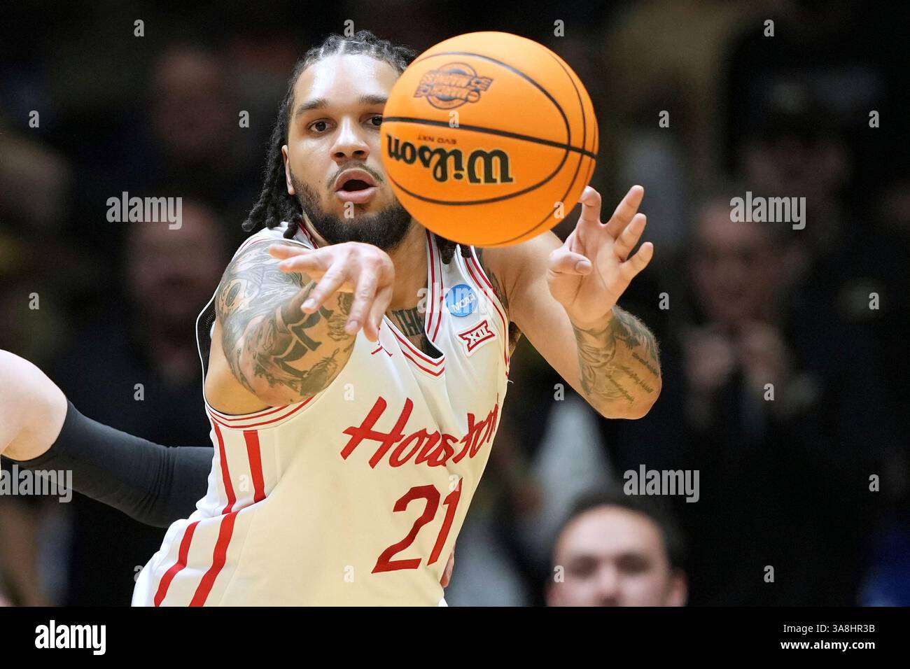 Houston's Emanuel Sharp passes during the first half in the Sweet 16 of ...