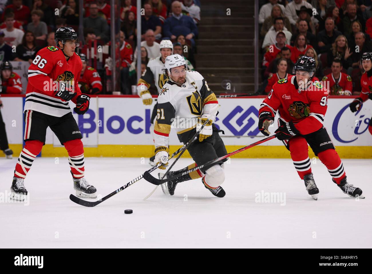 Vegas Golden Knights right wing Mark Stone (61) is tripped by Chicago ...