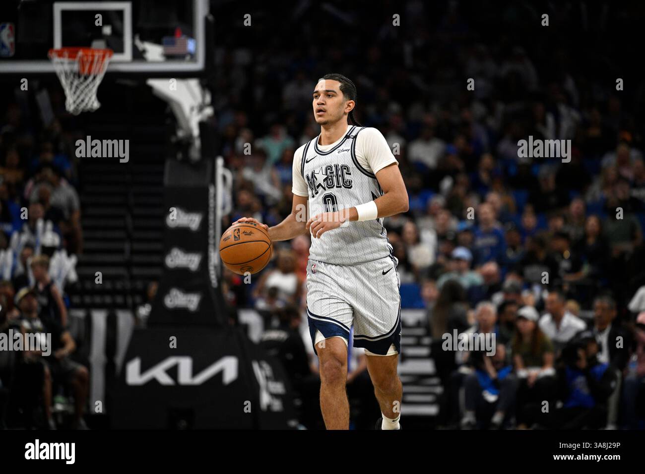 Orlando Magic guard Anthony Black (0) brings the ball up the court ...