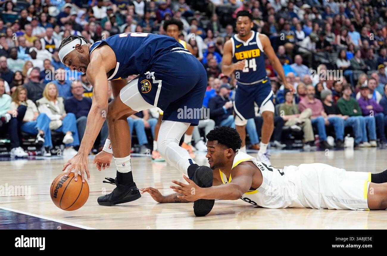 Denver Nuggets forward Zeke Nnaji, left, collects a loose ball as Utah ...