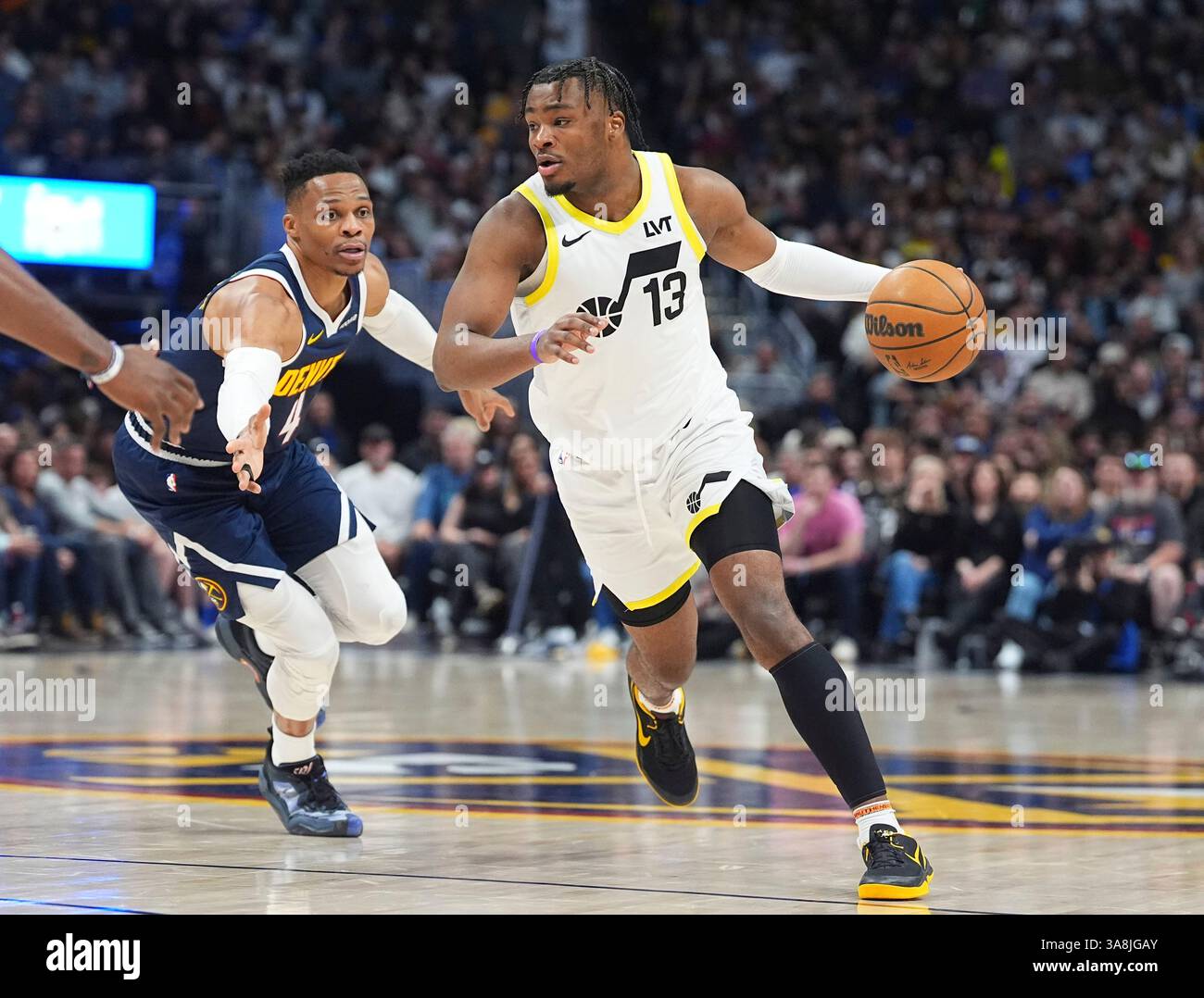 Utah Jazz guard Isaiah Collier, right, drives past Denver Nuggets guard ...