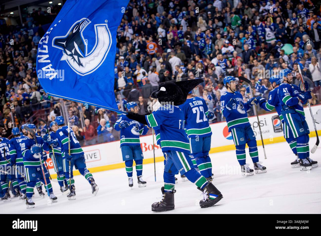 October 07, 2017: Canucks mascot Fin the Whale waves their flag after ...
