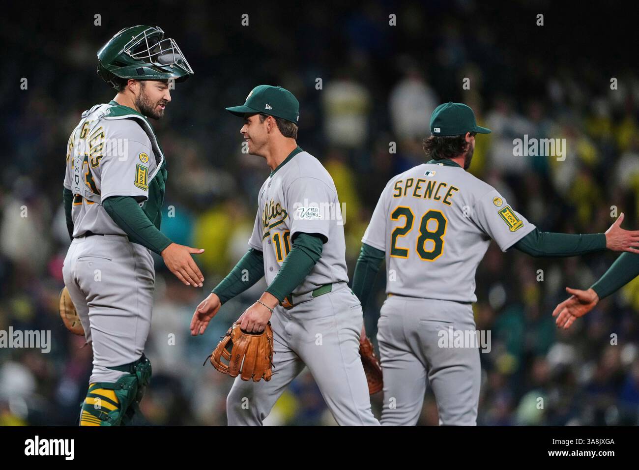 Athletics catcher Shea Langeliers, left, celebrates a 7-0 win over the ...