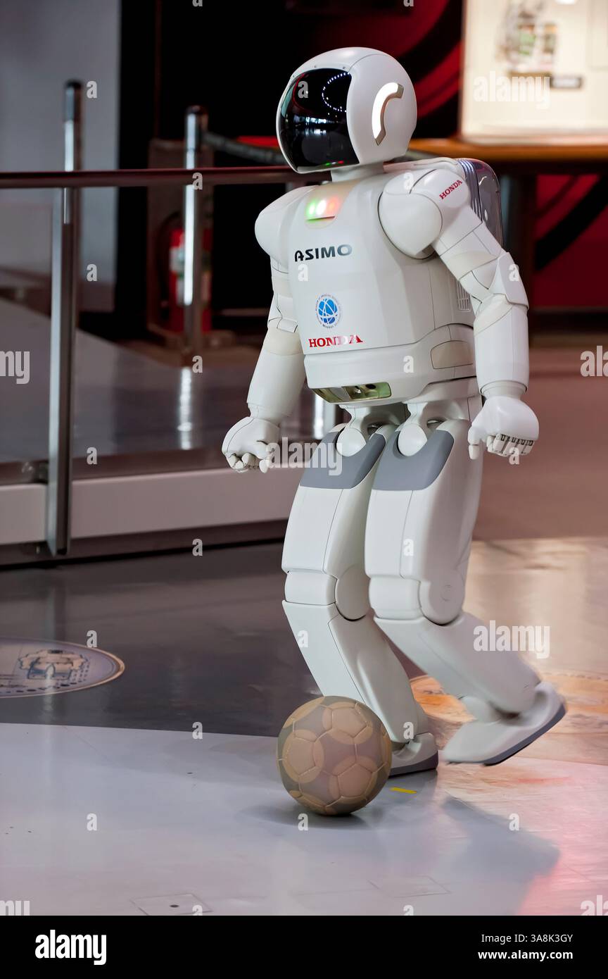 Honda's ASIMO (Advanced Step in Innovative Mobility) humanoid robot was ...