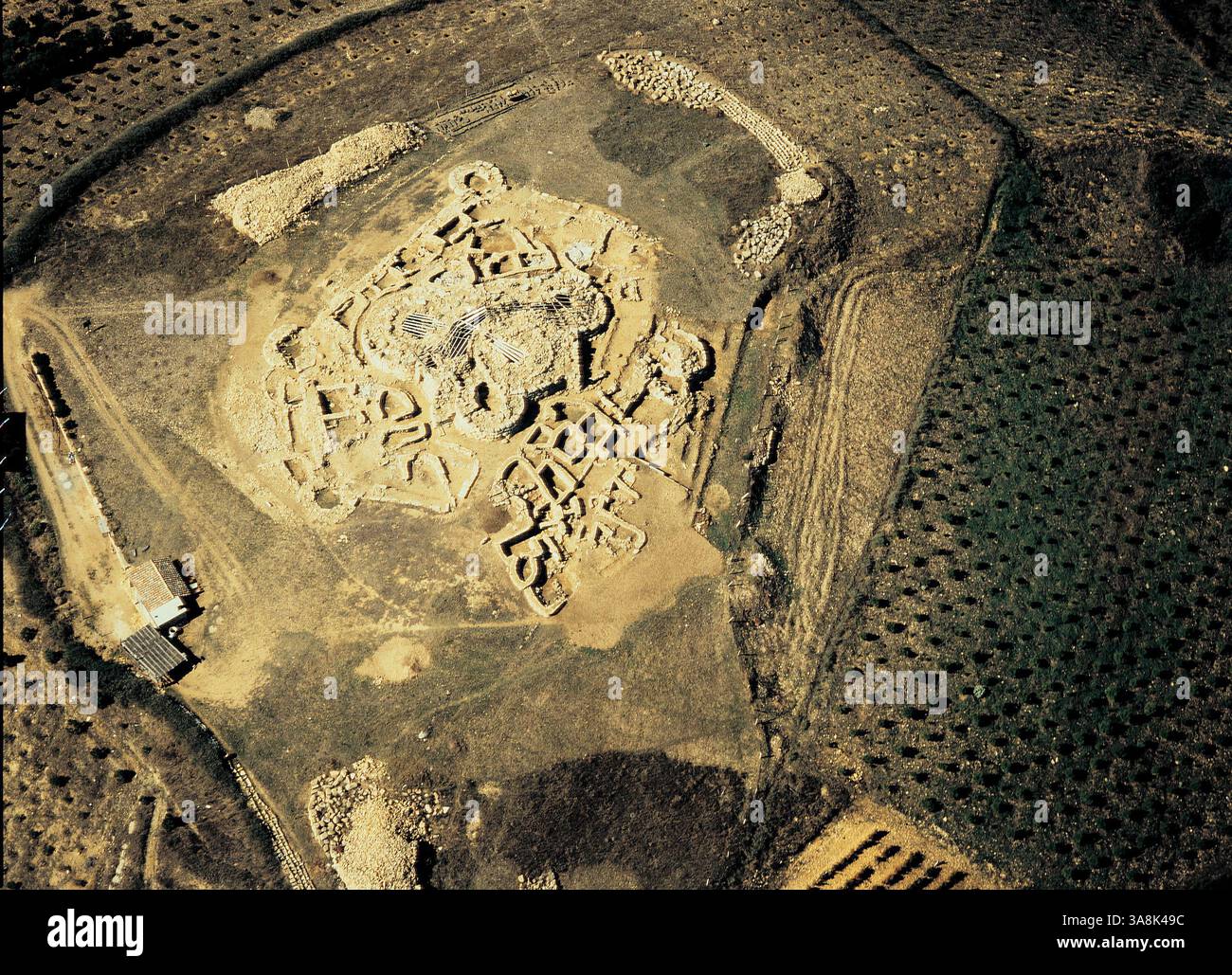 Unknown artist, Aerial view of the nuraghe trilobato Genna Maria and ...