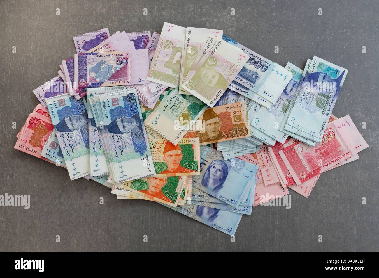 Pakistani Rupee Banknotes Spread on Gray Background Stock Photo - Alamy