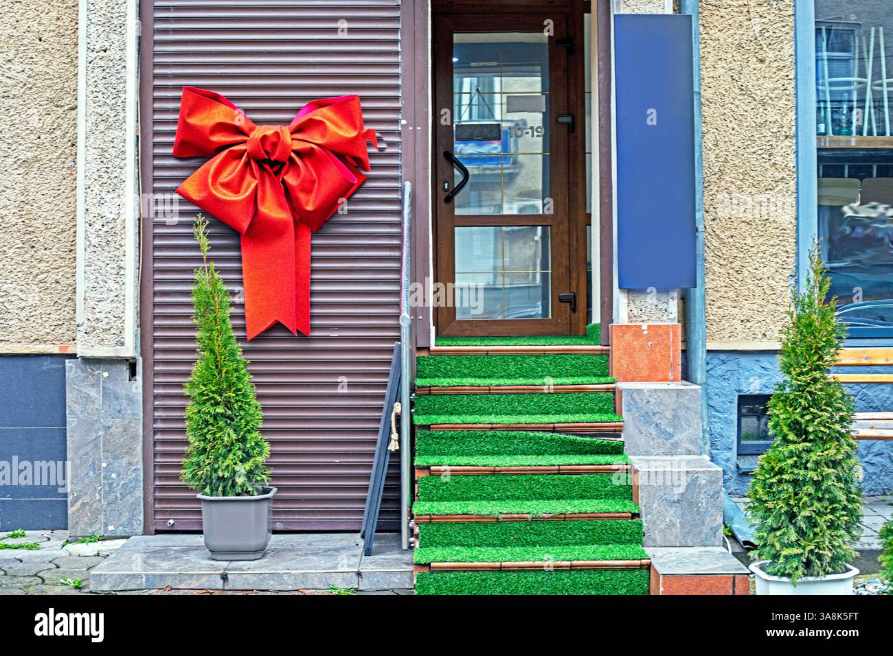 decoration with red bows outside shops and salons. Stylish and ...
