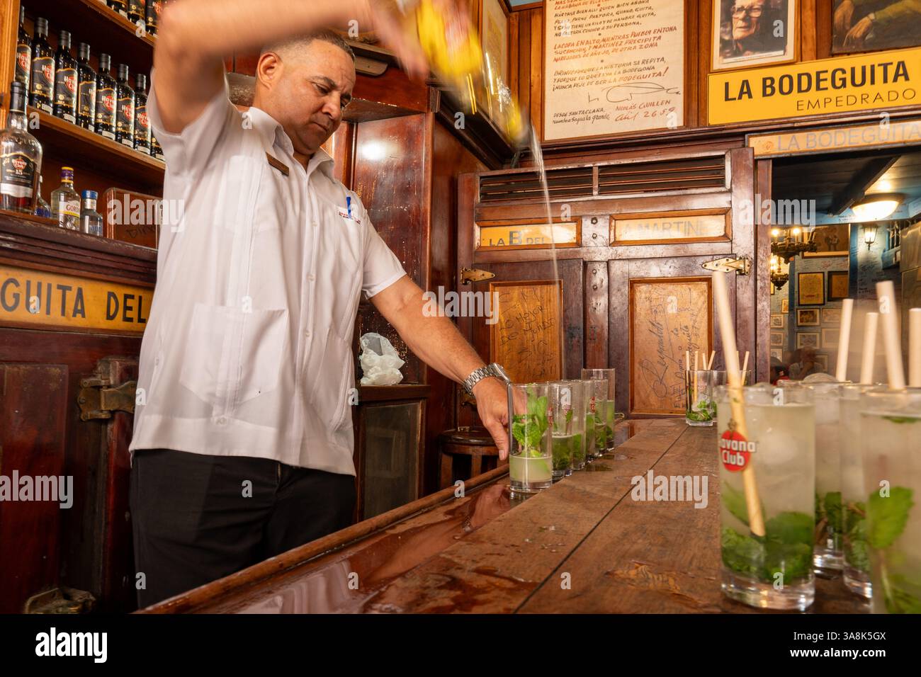 A bartender makes mojitos at La Bodeguita del Medio in Havana. Havana ...