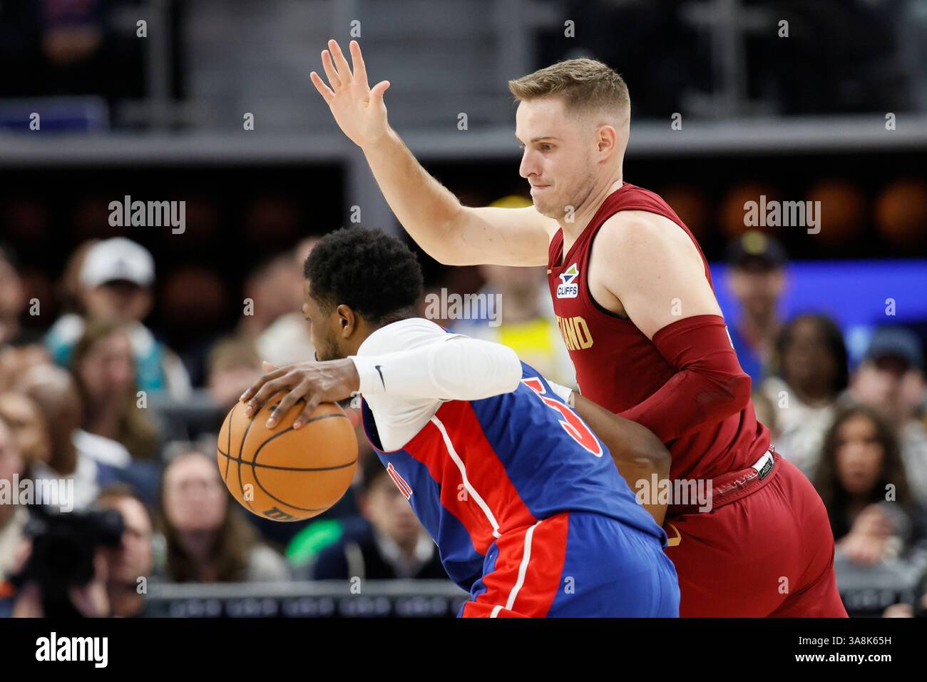 Cleveland Cavaliers guard Sam Merrill, right, guards Detroit Pistons ...
