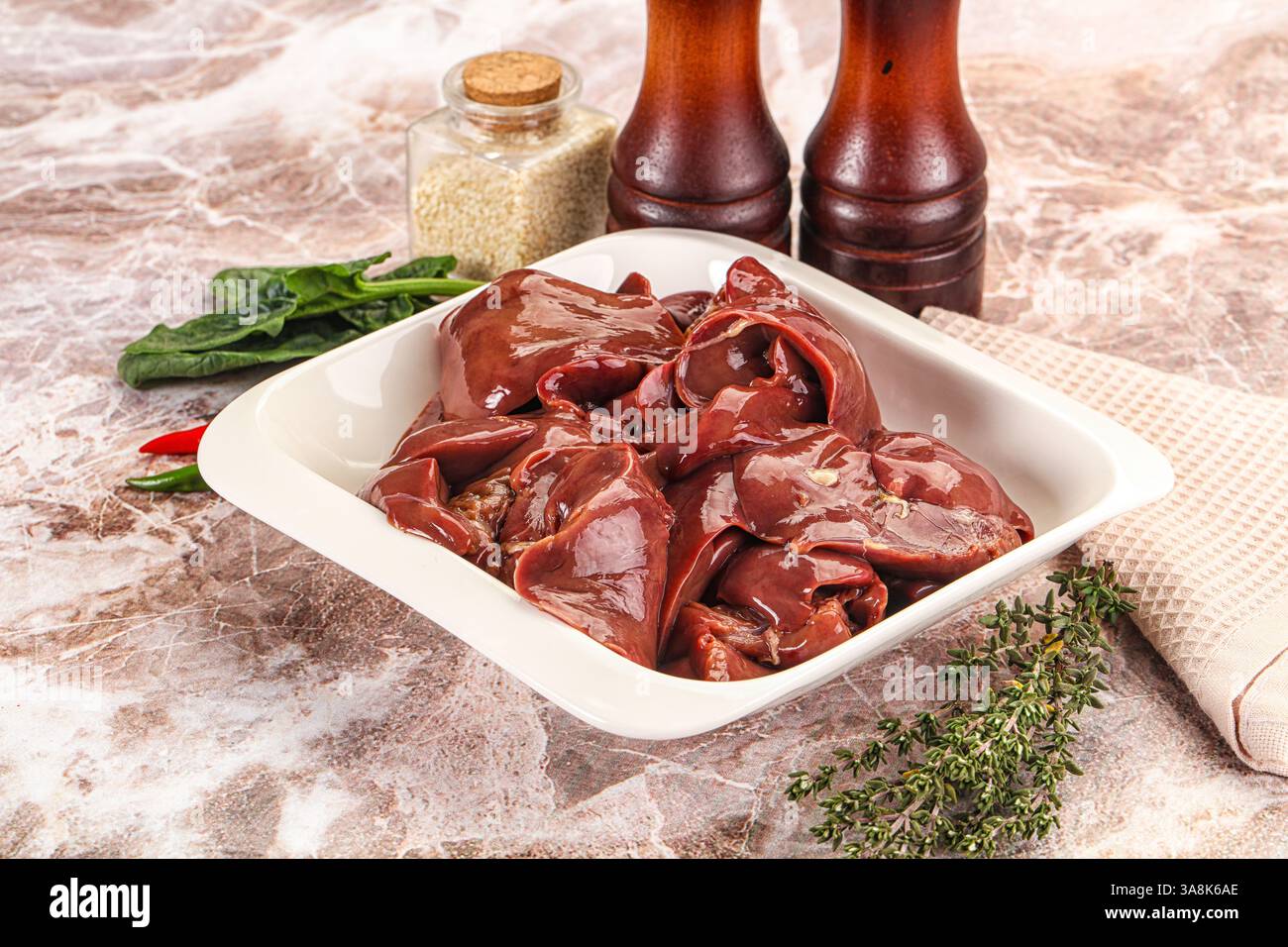 Raw fresh uncokked chicken liver in the bowl Stock Photo - Alamy