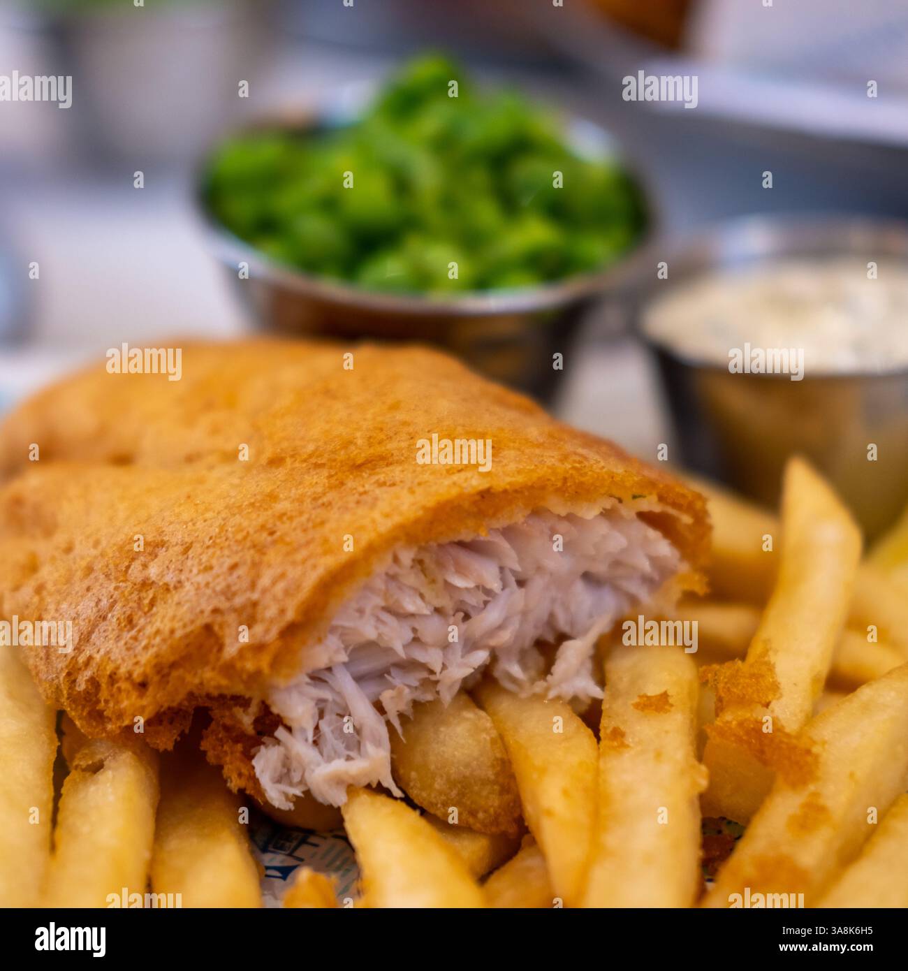 Delicious battered fish chips served hi-res stock photography and ...
