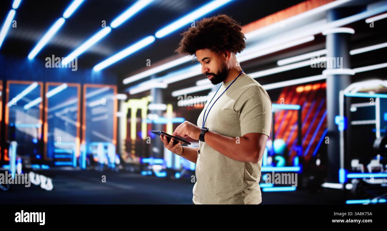 Fitness Trainer Evaluating Exercise Session Using Notes On Tablet Stock ...
