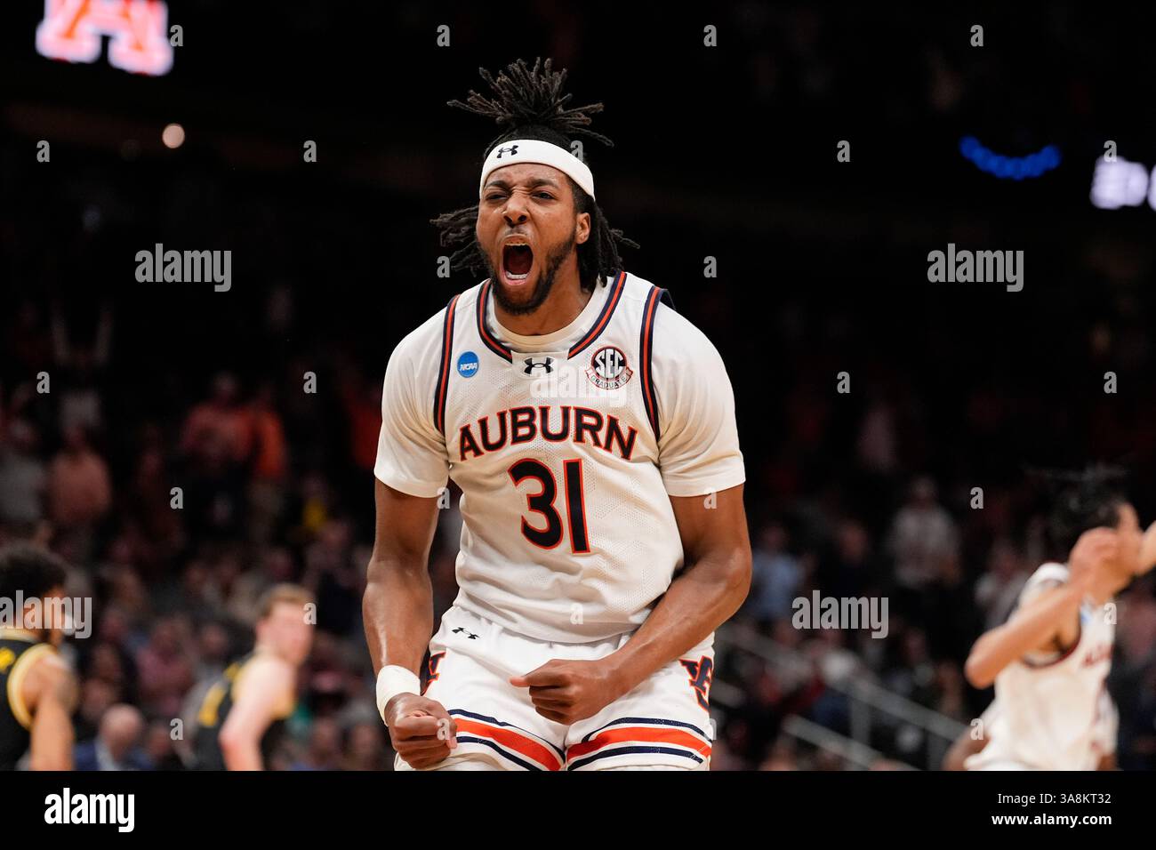 Auburn forward Chaney Johnson (31) celebrates scoring in the second ...
