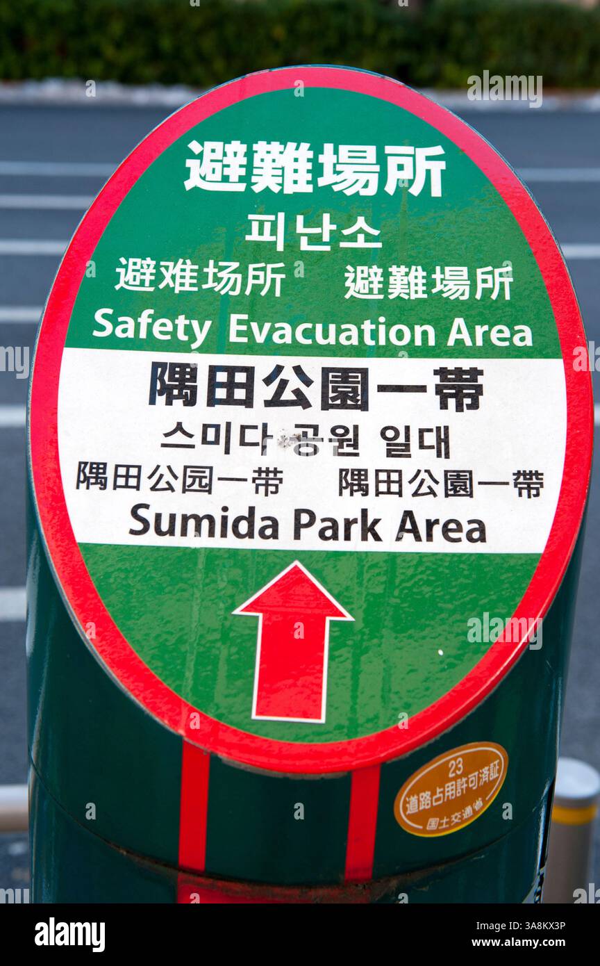 A natural disaster safety evacuation area sign in Japanese, Chinese ...