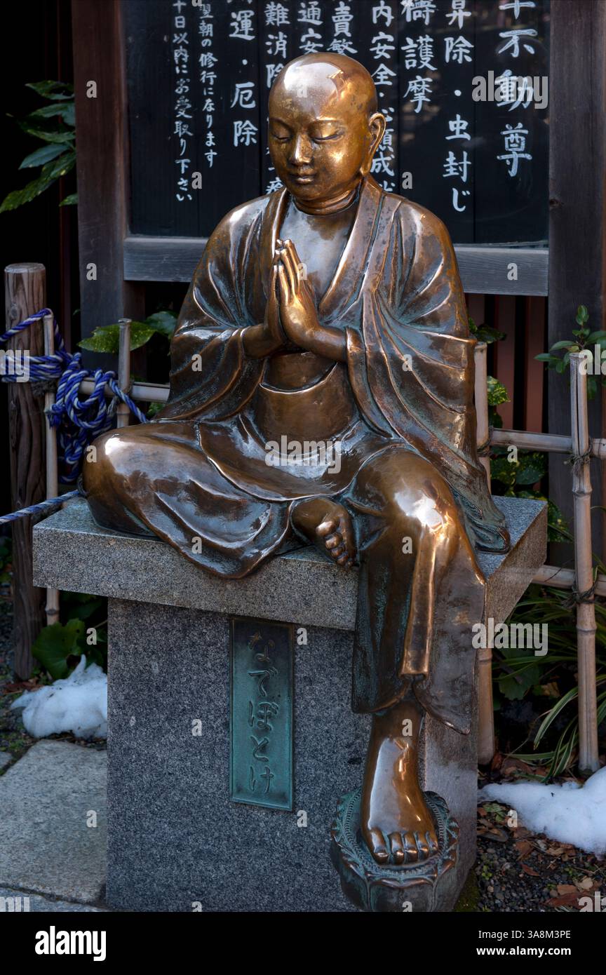 Sacred bronze healing Buddha statue at Sensoji Temple in Tokyo. Rubbing ...
