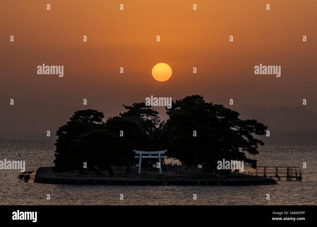 Sunset over the Shinto shrine on Yomegashima, an island in Shinjiko (or ...