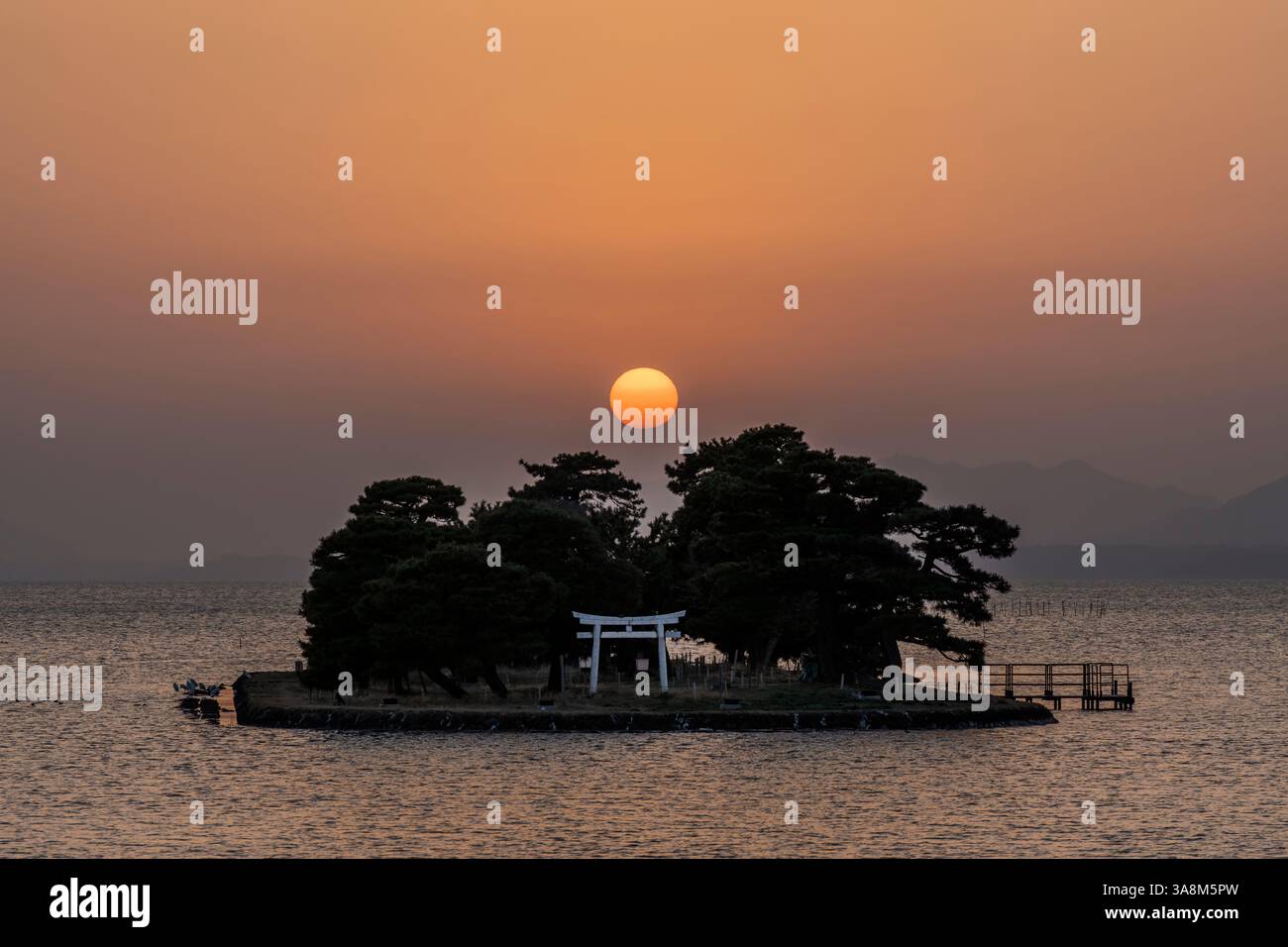 Sunset over the Shinto shrine on Yomegashima, an island in Shinjiko (or ...