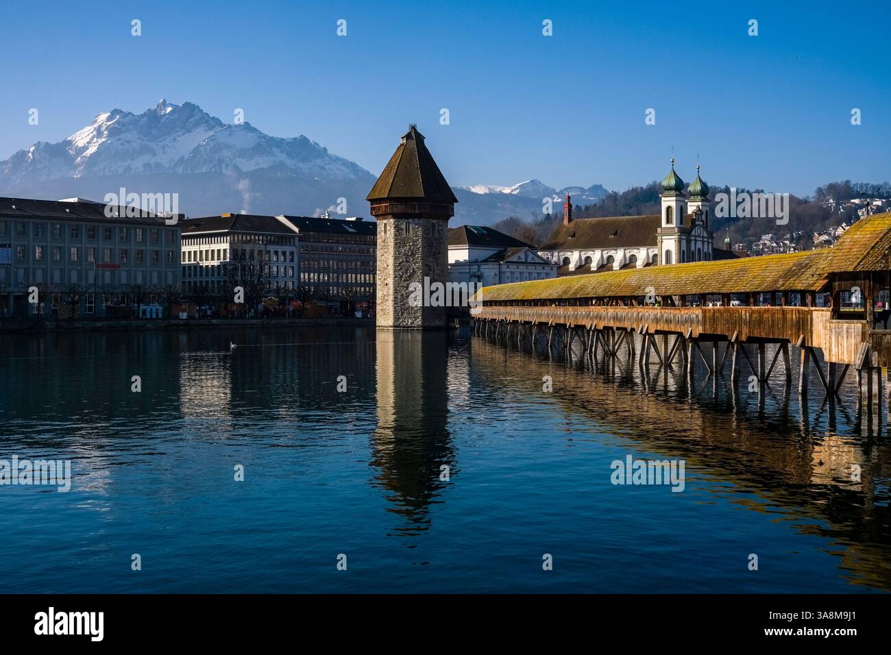 View across the river Reuss to the Chapel Bridge, Water tower and ...